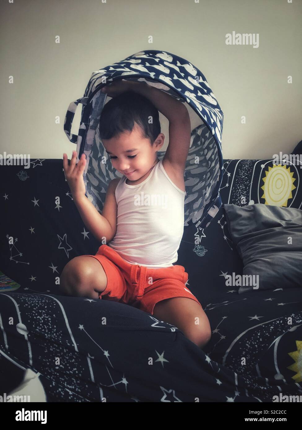 Boy playing hide seek hi-res stock photography and images - Alamy