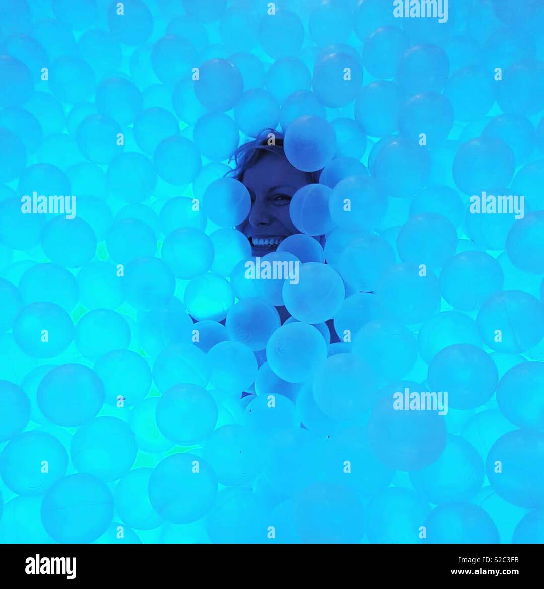 Fun in the ball pit Stock Photo - Alamy