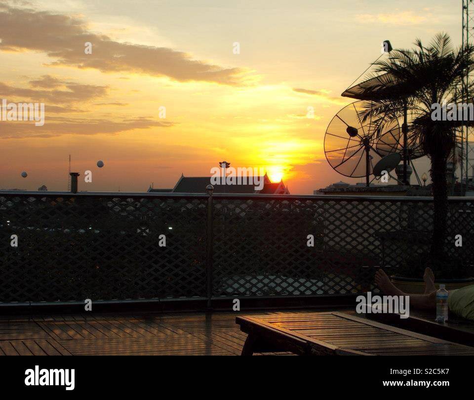 Bangkok sunset - taken from rooftop bar in Bangkok Stock Photo - Alamy