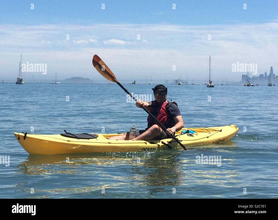Kayaking in the bay Stock Photo - Alamy