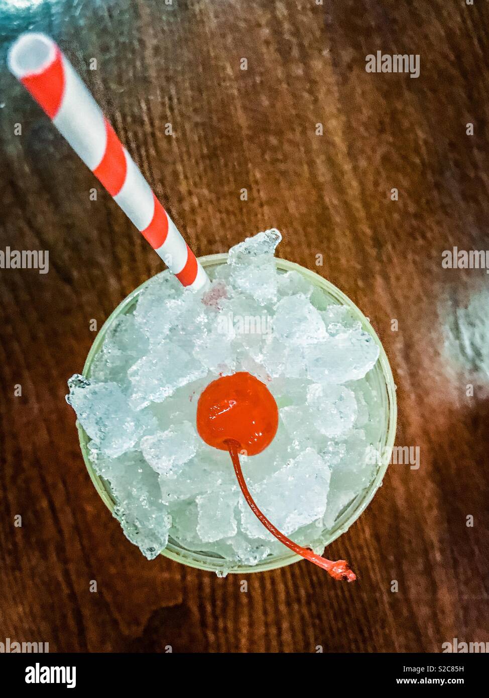 Cocktail with cherry and a straw Stock Photo - Alamy
