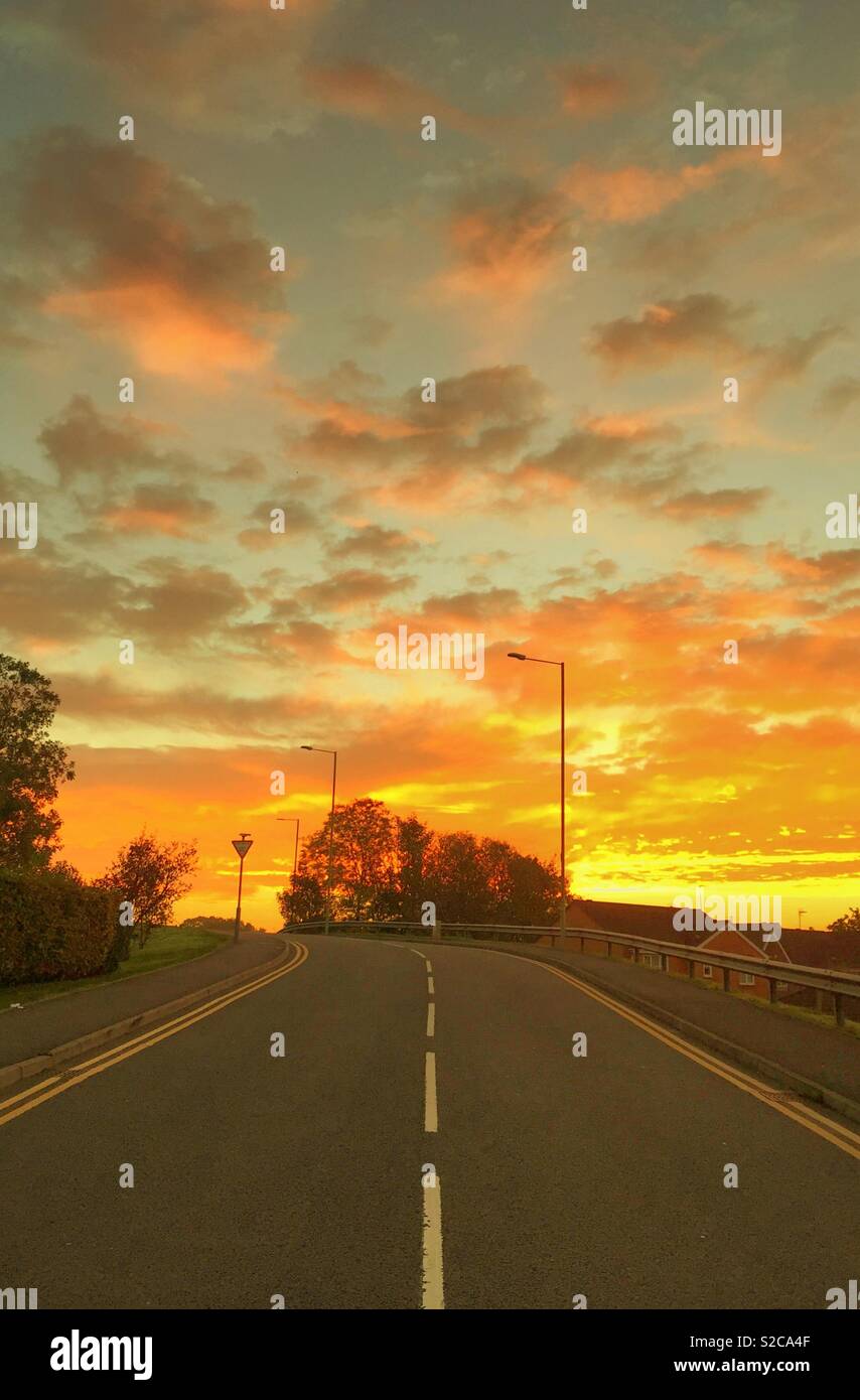 Empty road at sunrise Stock Photo - Alamy