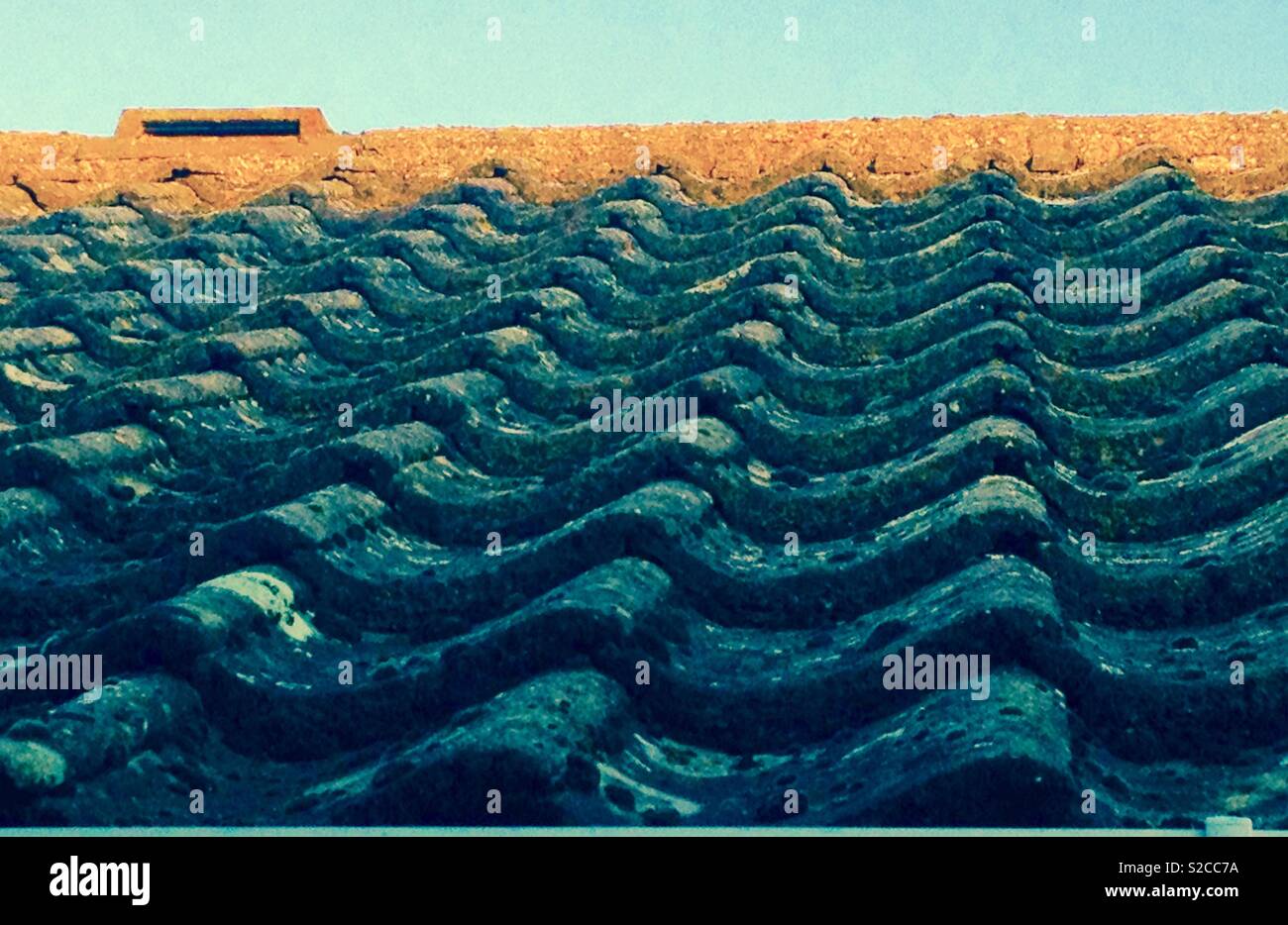 Ceramic roof tiles resembling stylised waves off a sandy beach Stock ...