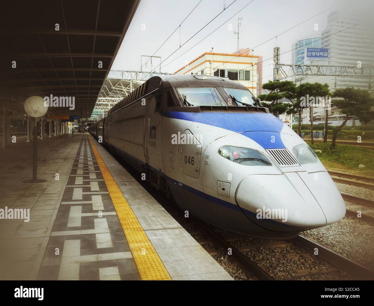 A KTX train sits at a quiet platform ready to depart from Seoul Station ...