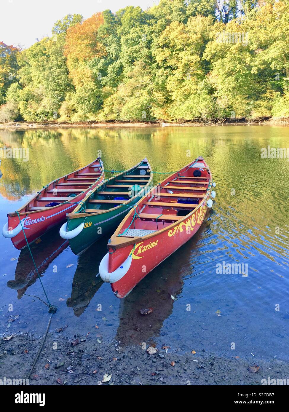 Canoes on a River Stock Photo - Alamy