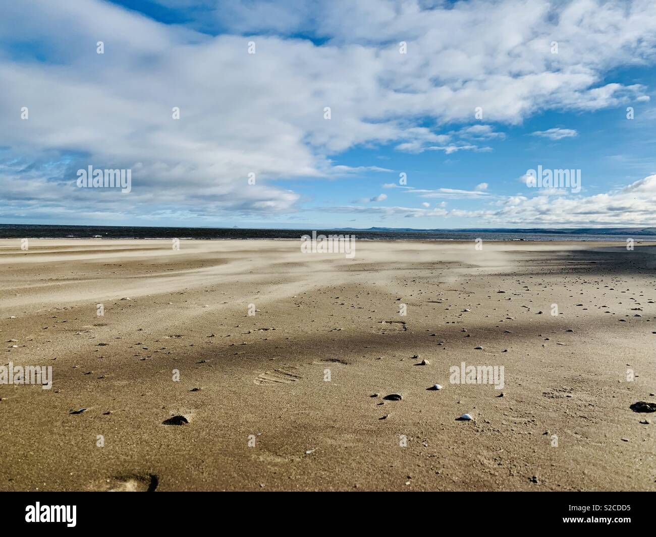 Wind blowing sand across beach hi-res stock photography and images - Alamy