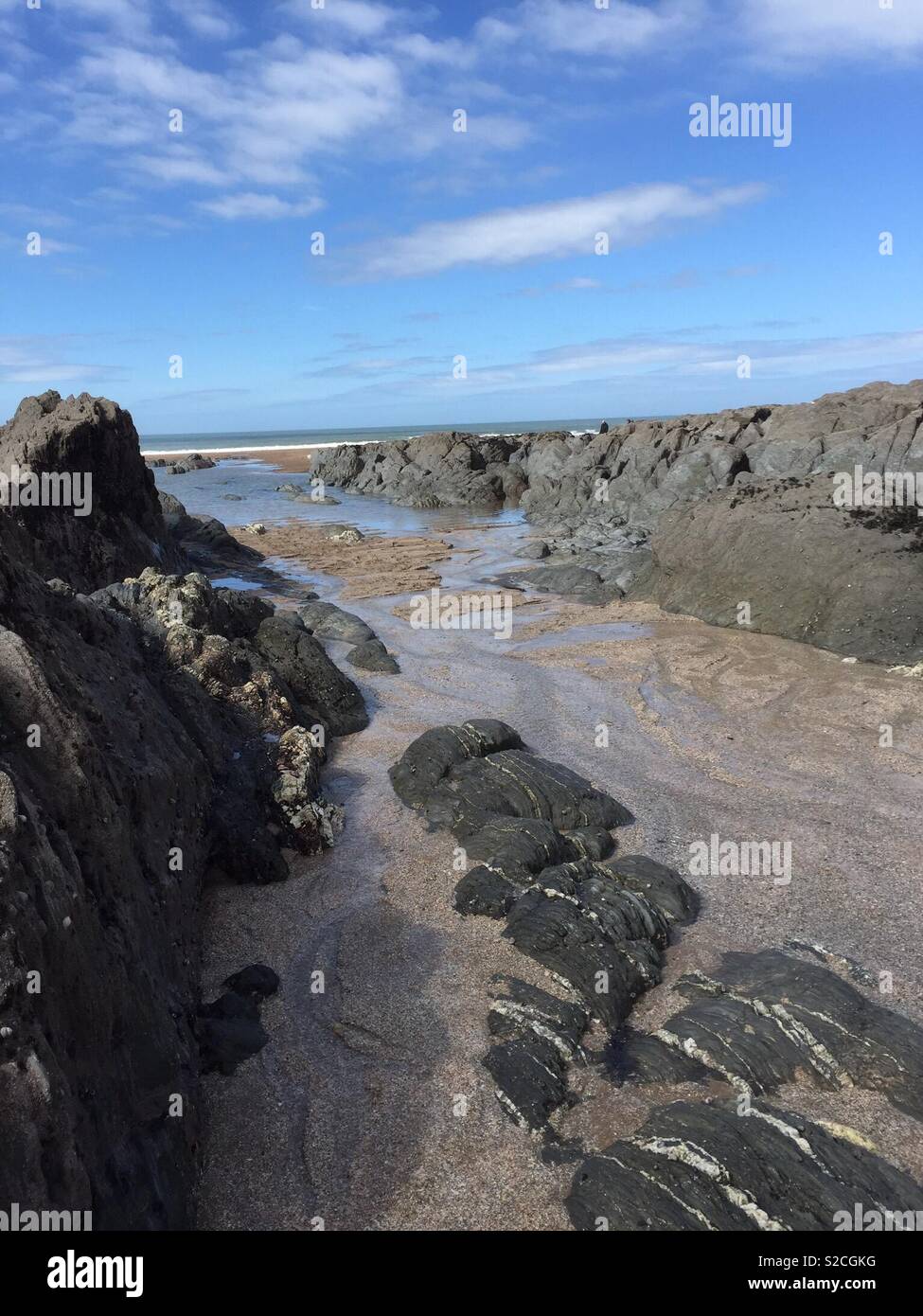 Inlet and rock pools at Woolacombe, Devon Stock Photo - Alamy