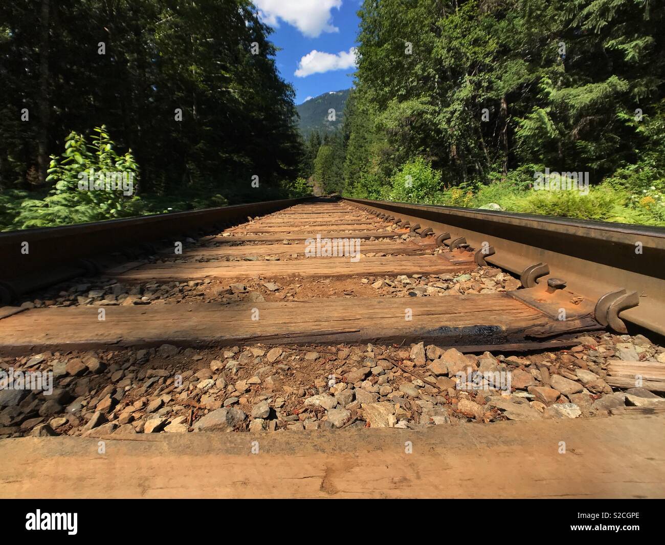 Train tracks through the mountain Stock Photo - Alamy