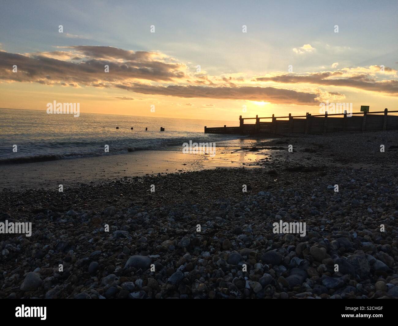 Pebble beach at sunset hi-res stock photography and images - Alamy