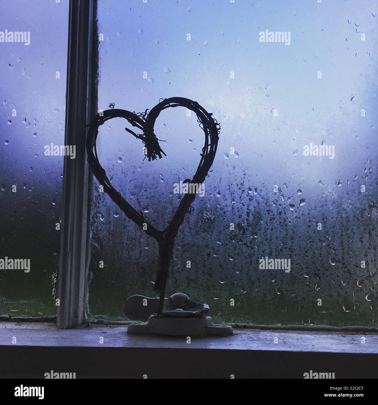 Rain window heart hi-res stock photography and images - Alamy