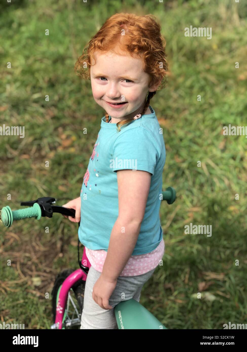 Girl on bike Stock Photo - Alamy