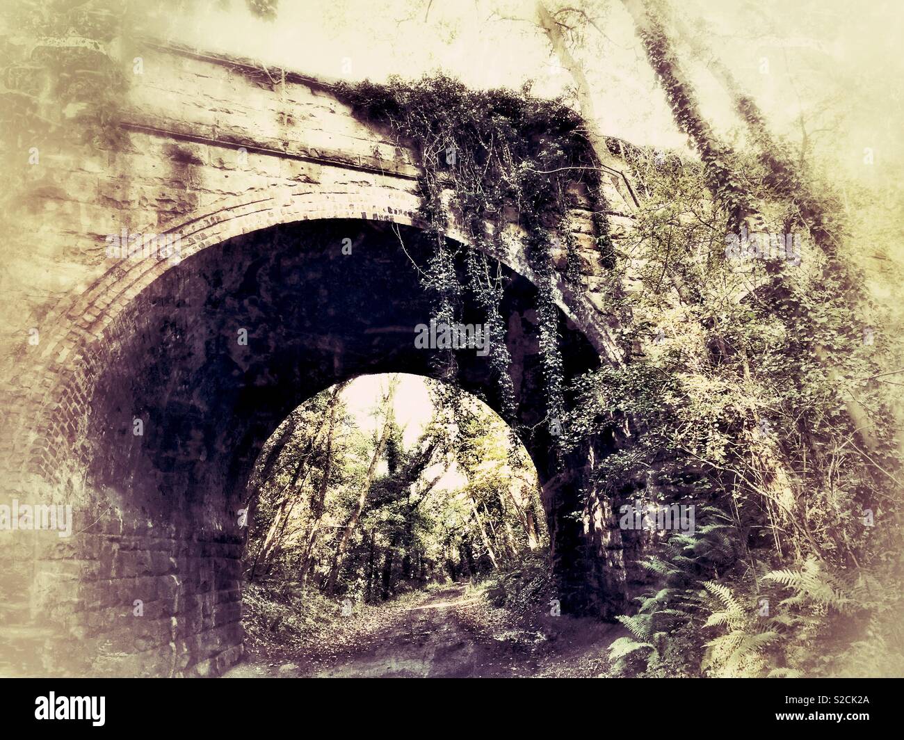 Grunge Effect of one of many road bridges over “Cinder Path Trail” of ...