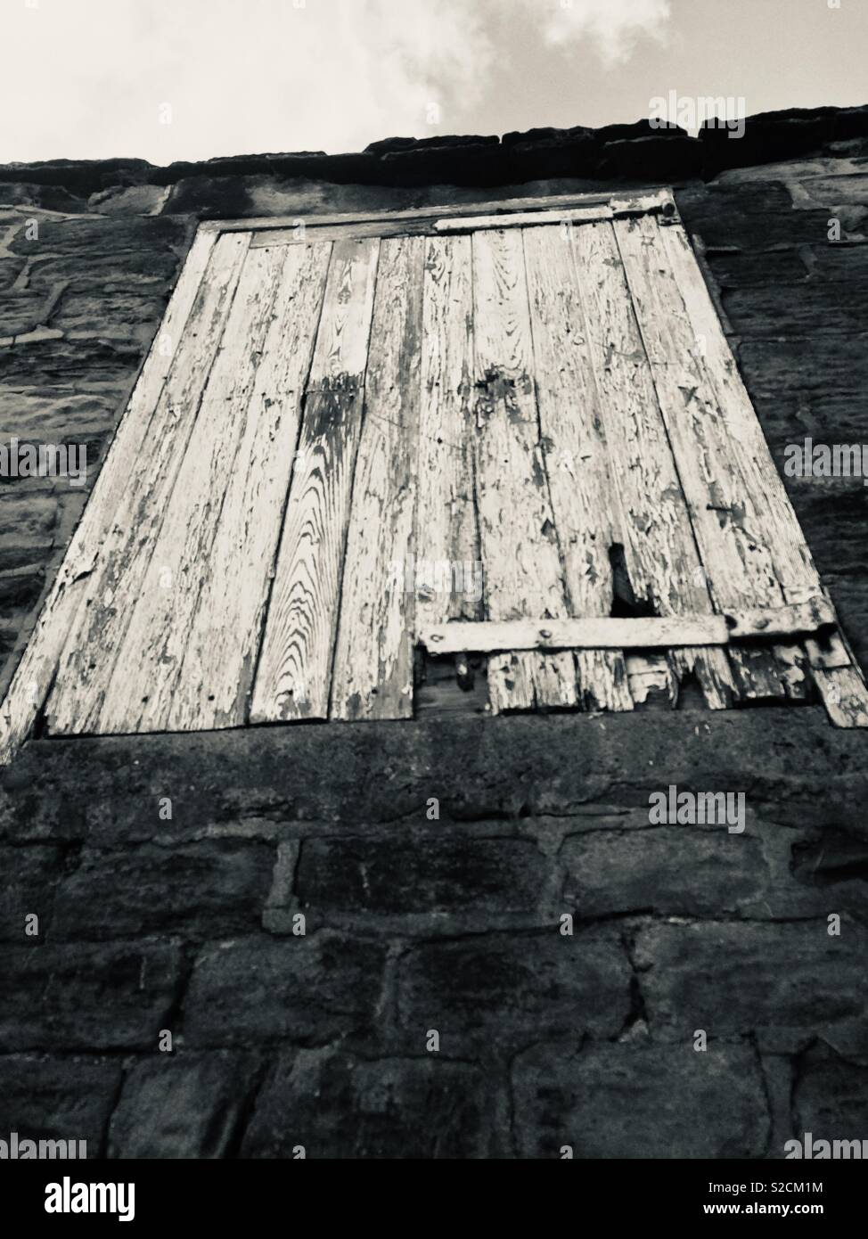 Old barn loading hatch Stock Photo - Alamy