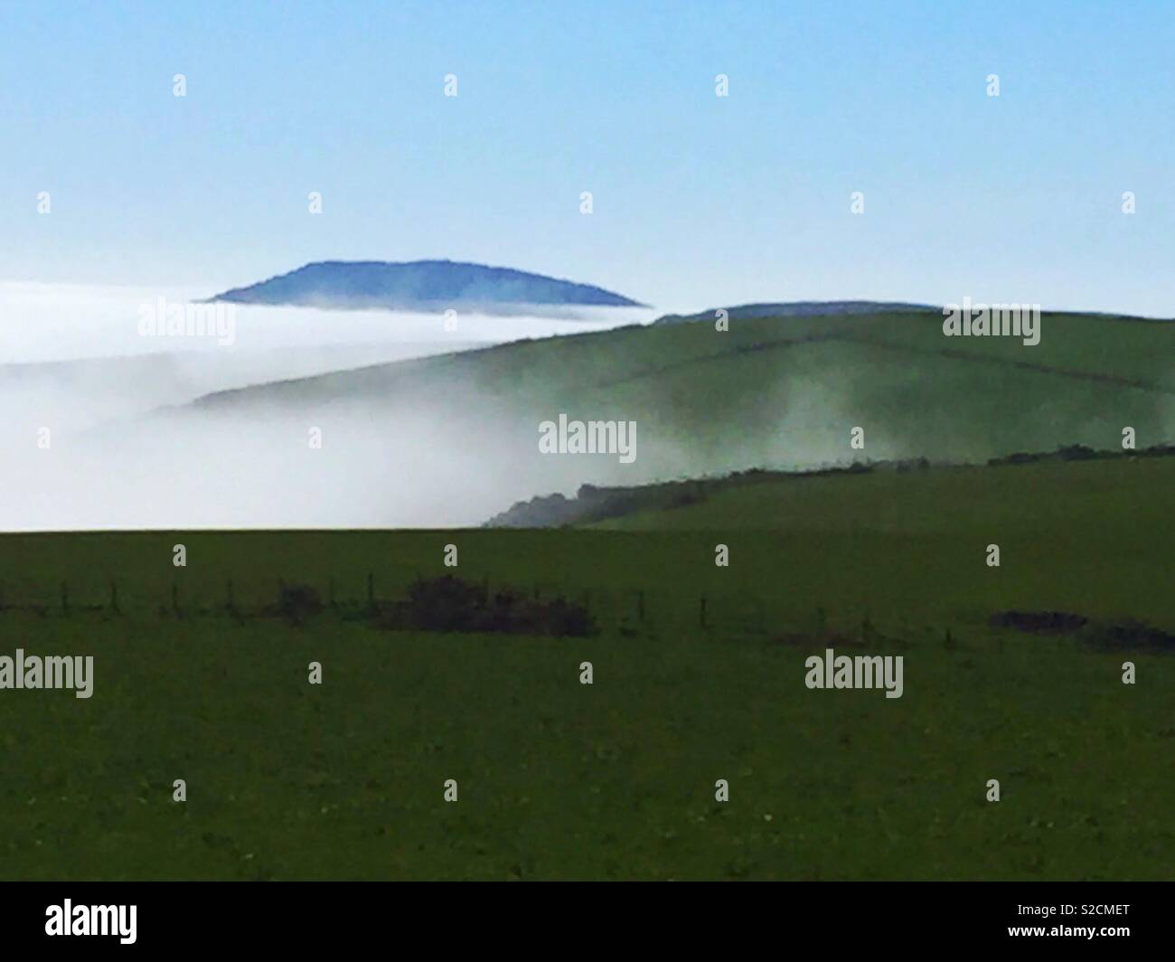 A view of Bardsey Island from Rhiw with sea mist 2018 Stock Photo - Alamy