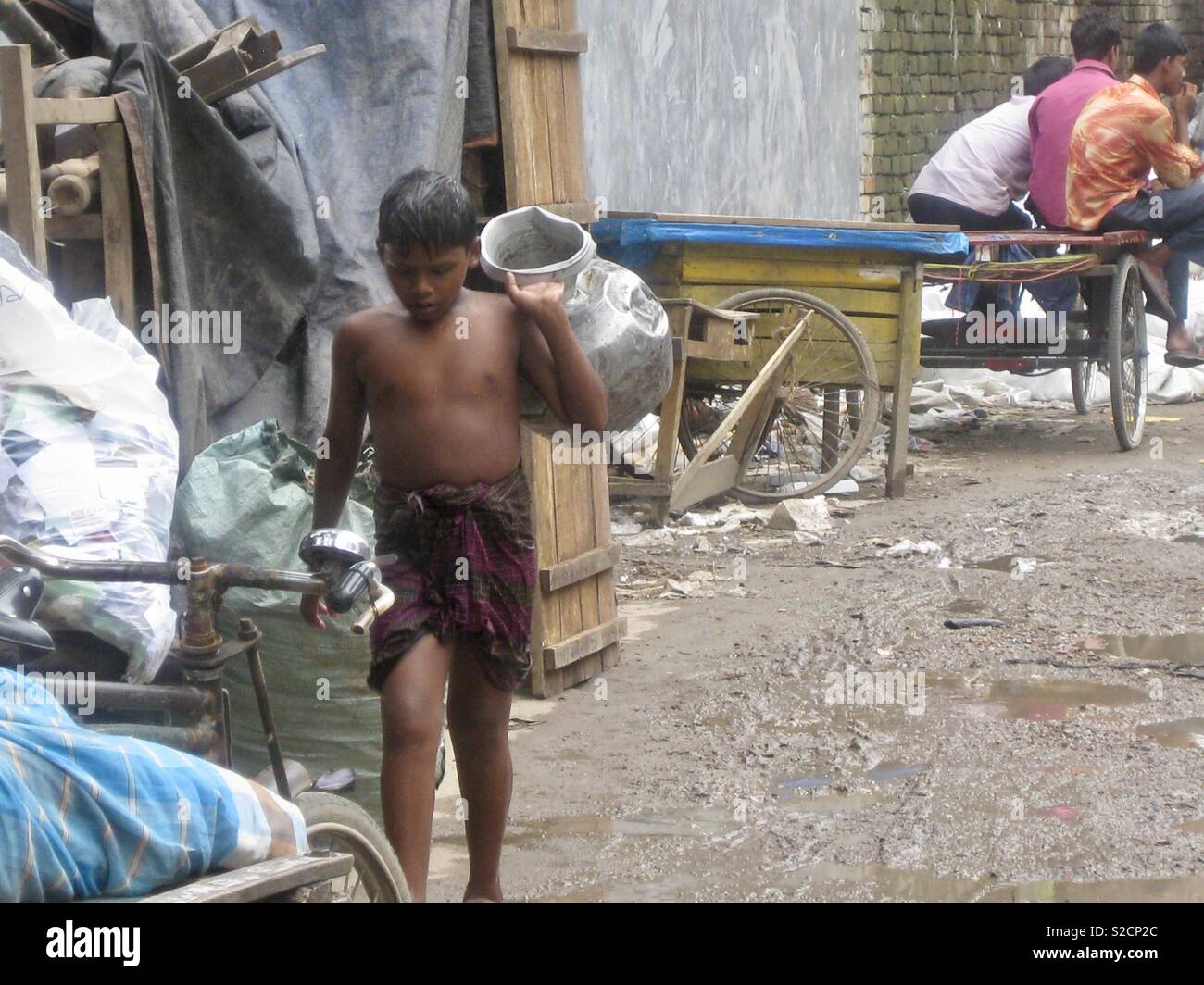 Boy fetching water hi-res stock photography and images - Alamy