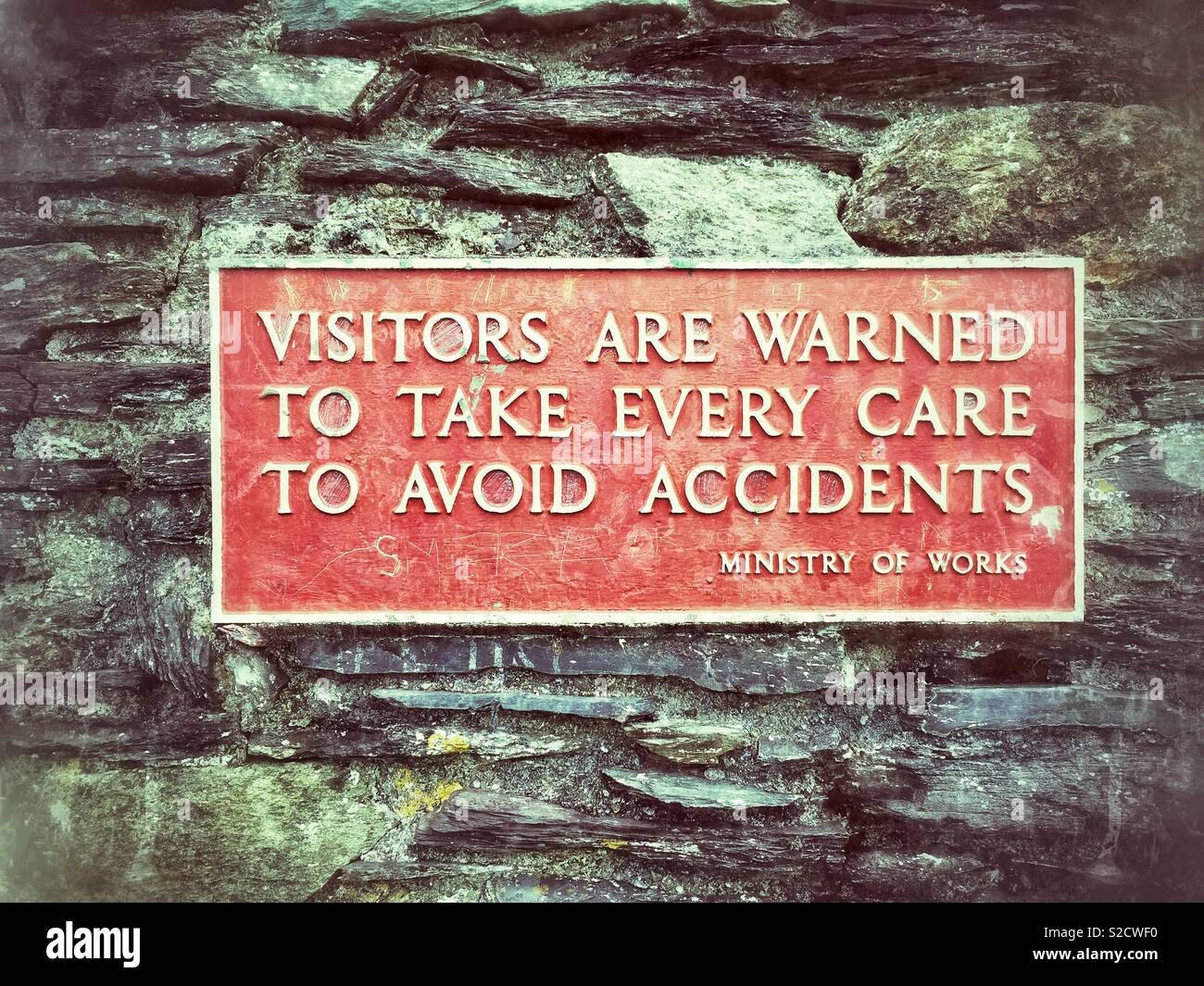 Warning sign on monument Stock Photo - Alamy