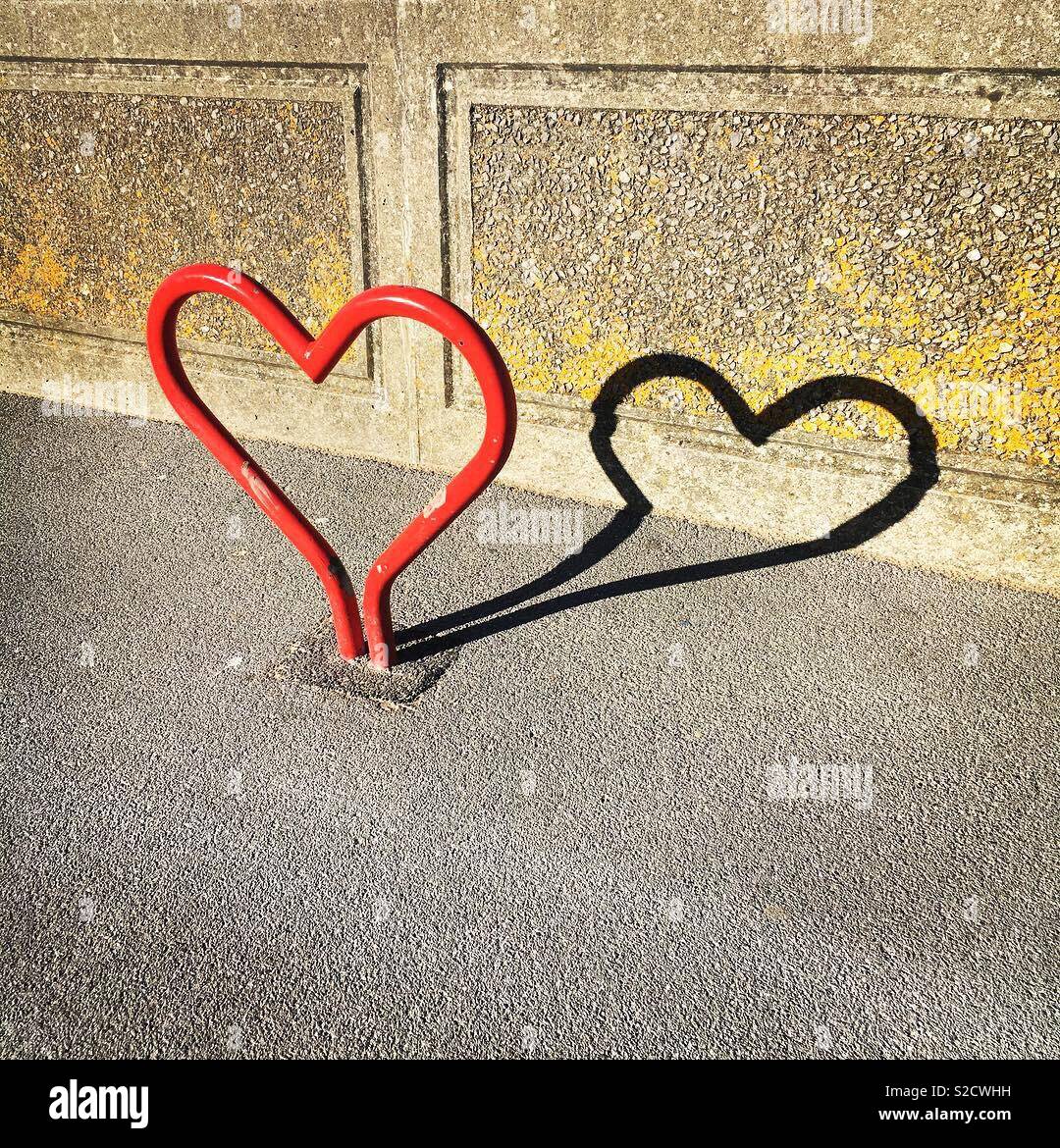 Standing in the shadow of Love Stock Photo - Alamy