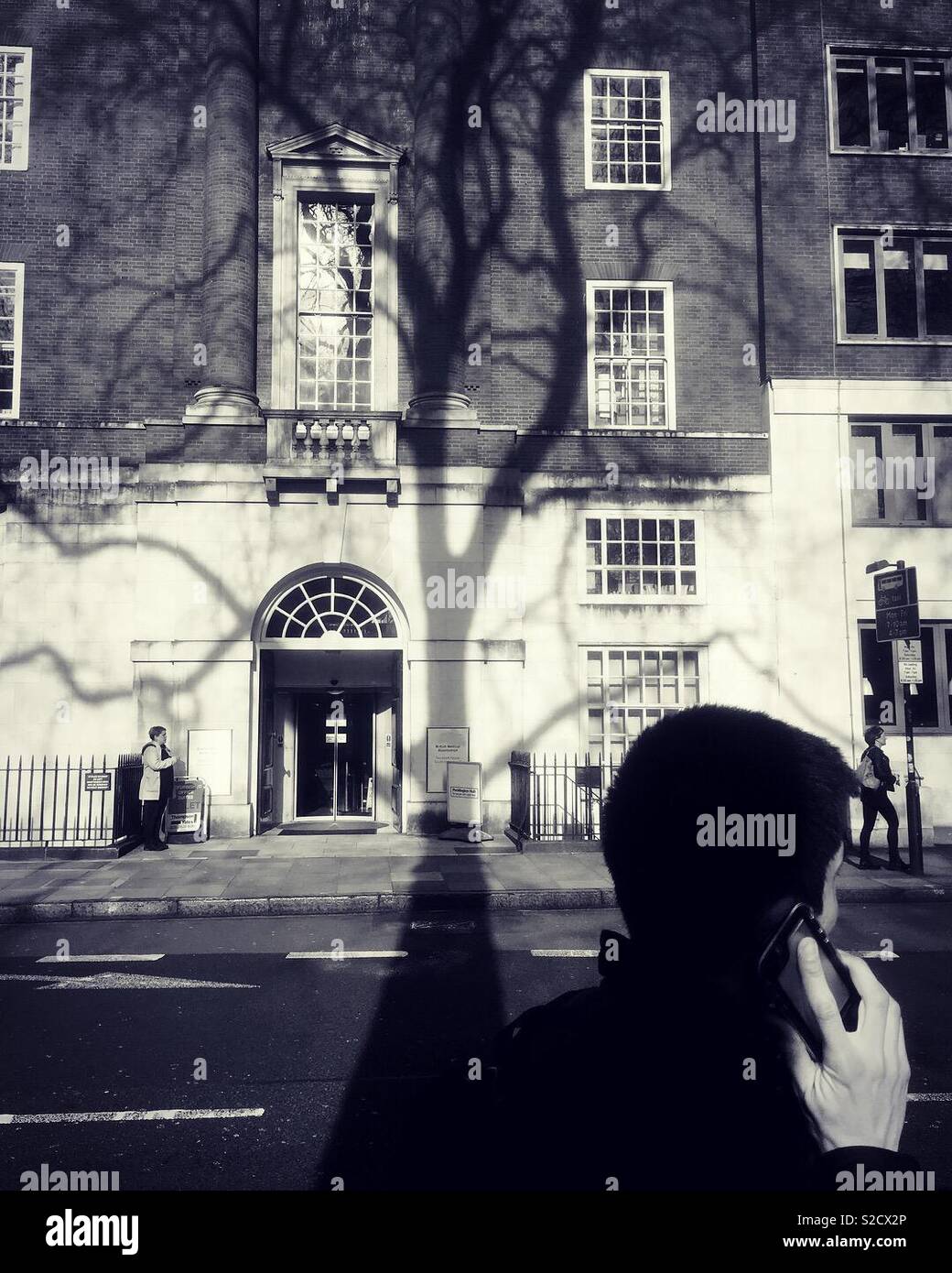 Shadow man walking in street hi-res stock photography and images - Alamy