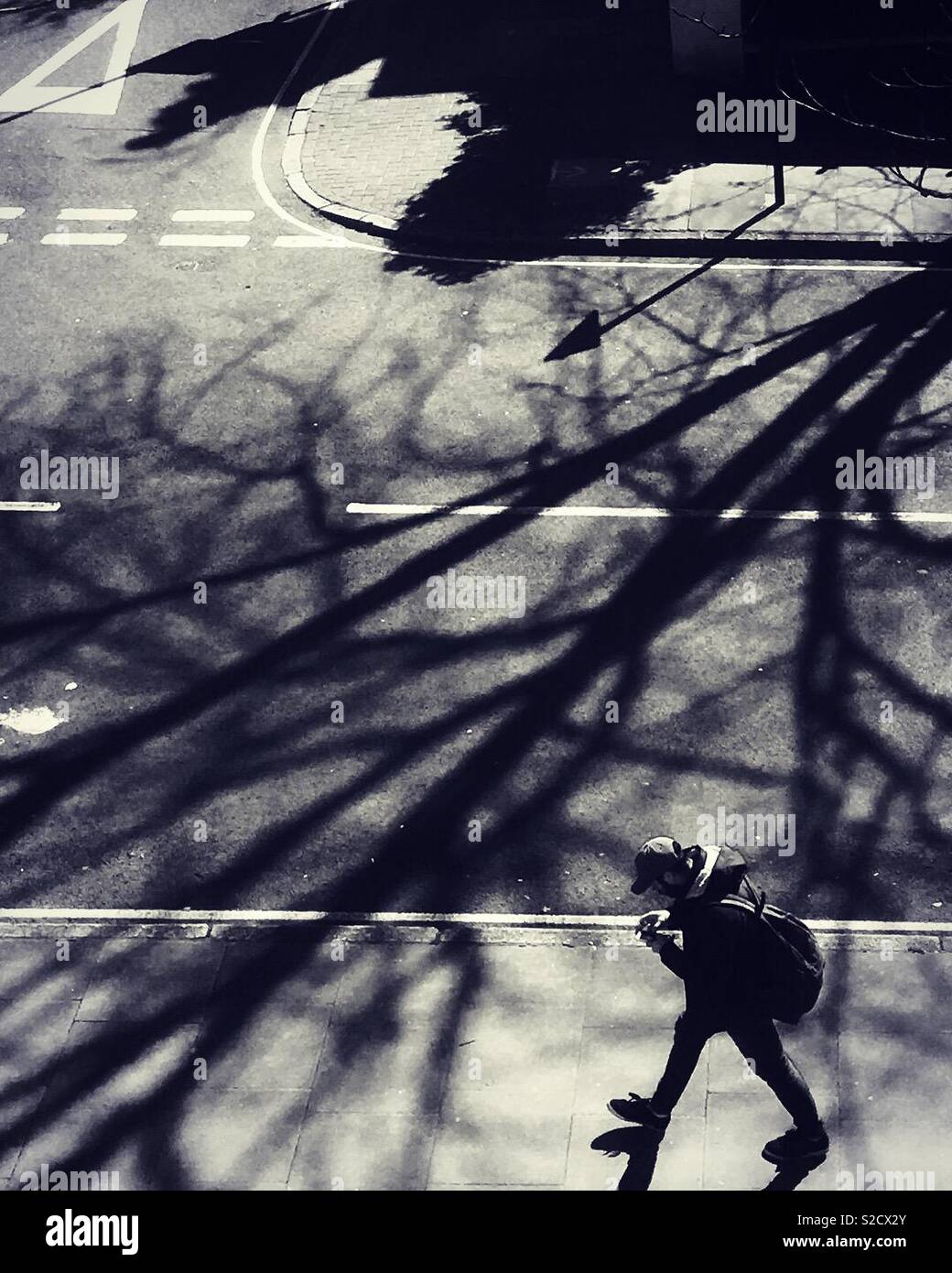 Shadow man walking in street hi-res stock photography and images - Alamy