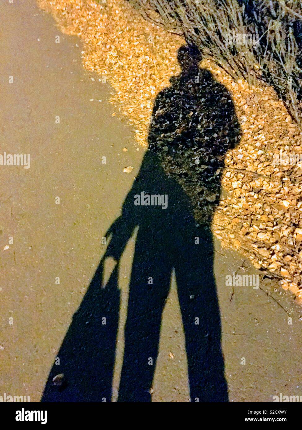 Human shadow on street hi-res stock photography and images - Alamy