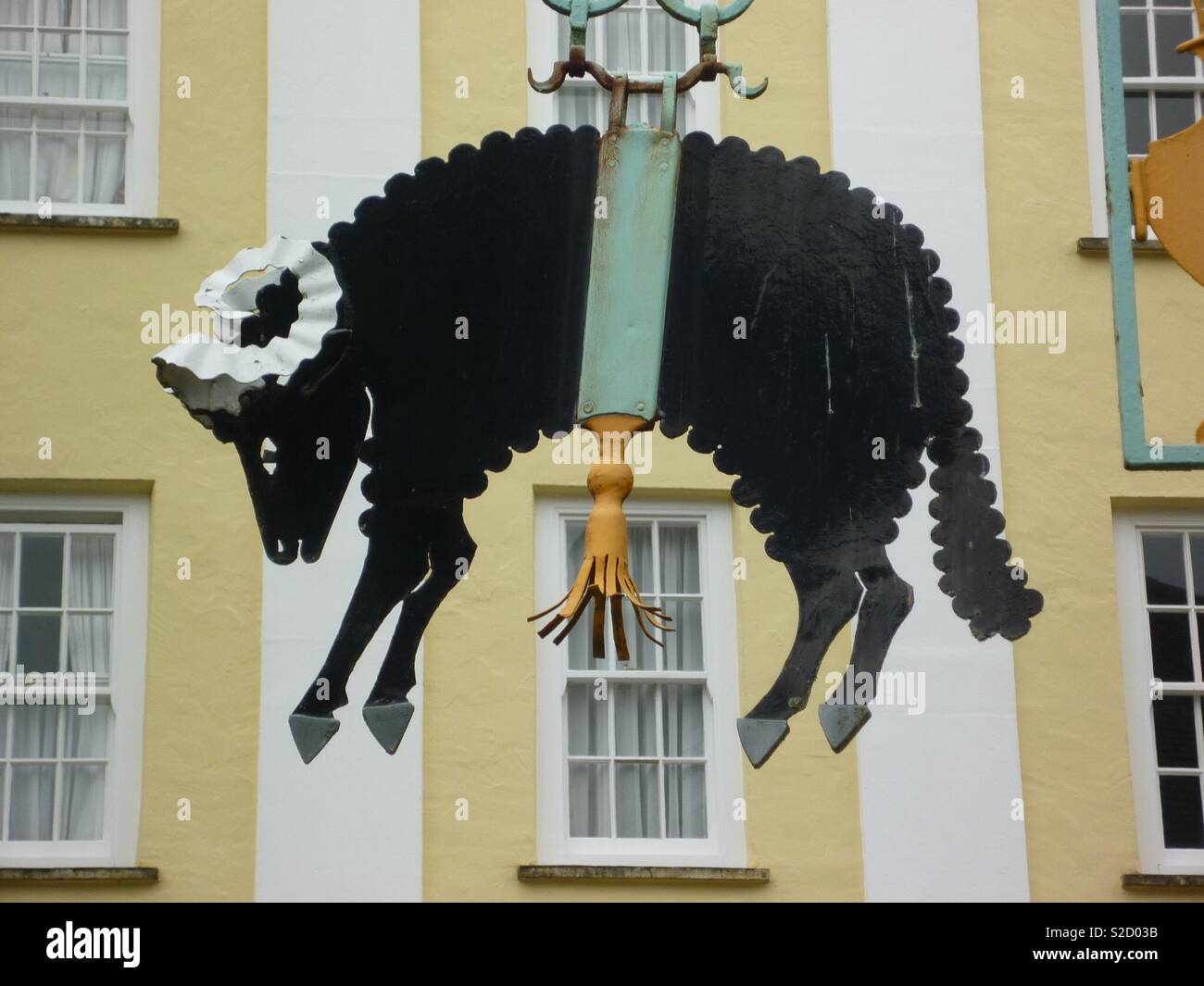 Black Ram sign hanging at Portmeirion Stock Photo - Alamy