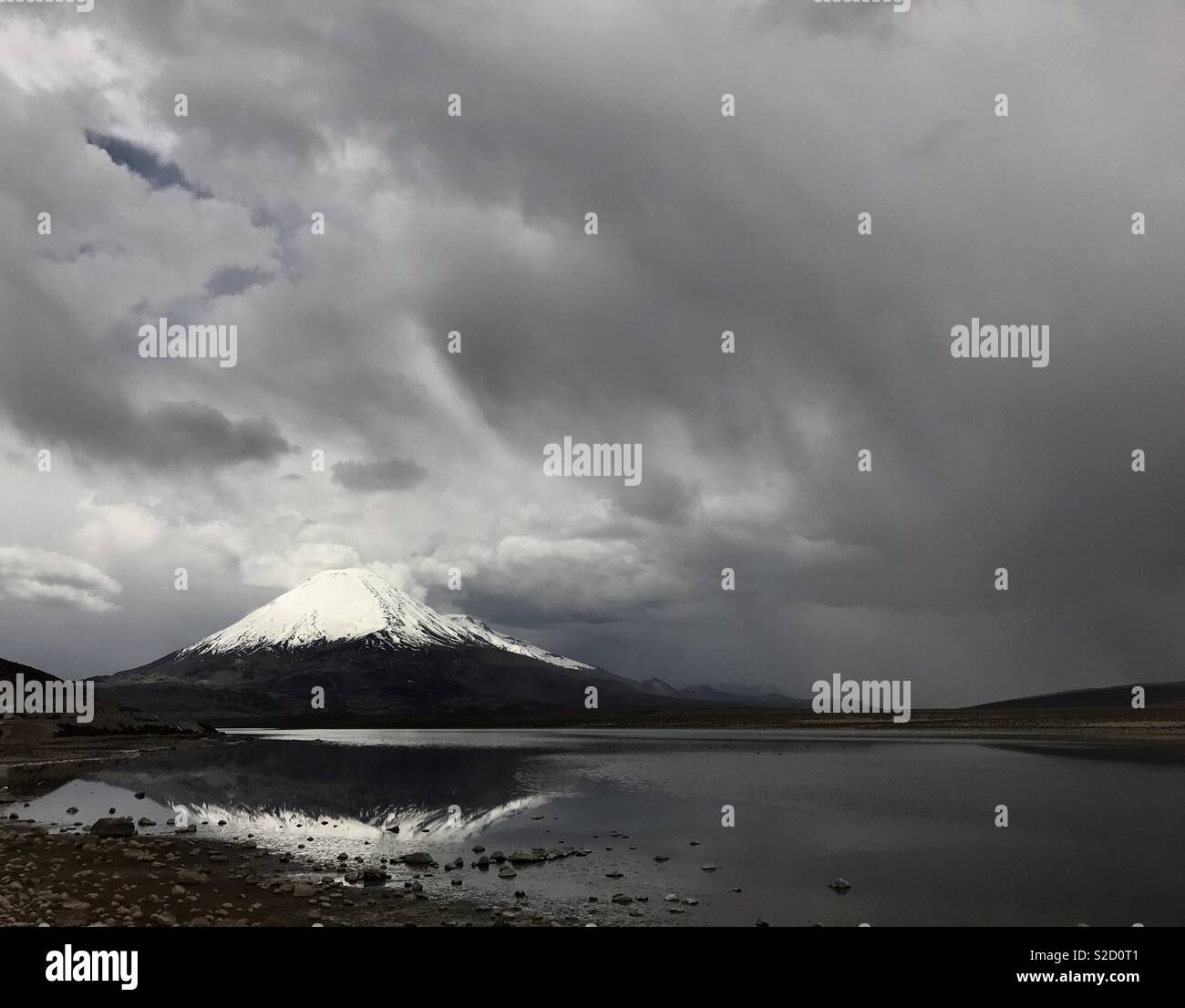 Storm clouds over volcano Parinacota, Lauca National Park, Andes ...