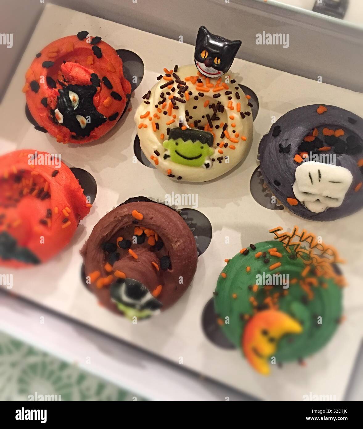 Festive Halloween themed cupcakes on display in a bakery shop, NYC, USA ...