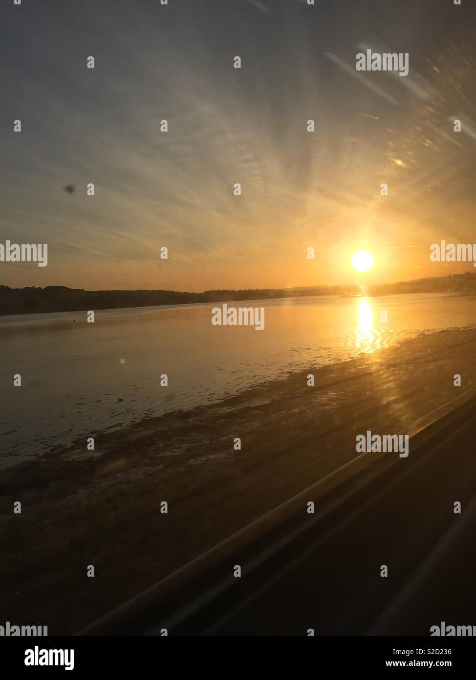 Beautiful sunset taken from train window of the beach Stock Photo - Alamy