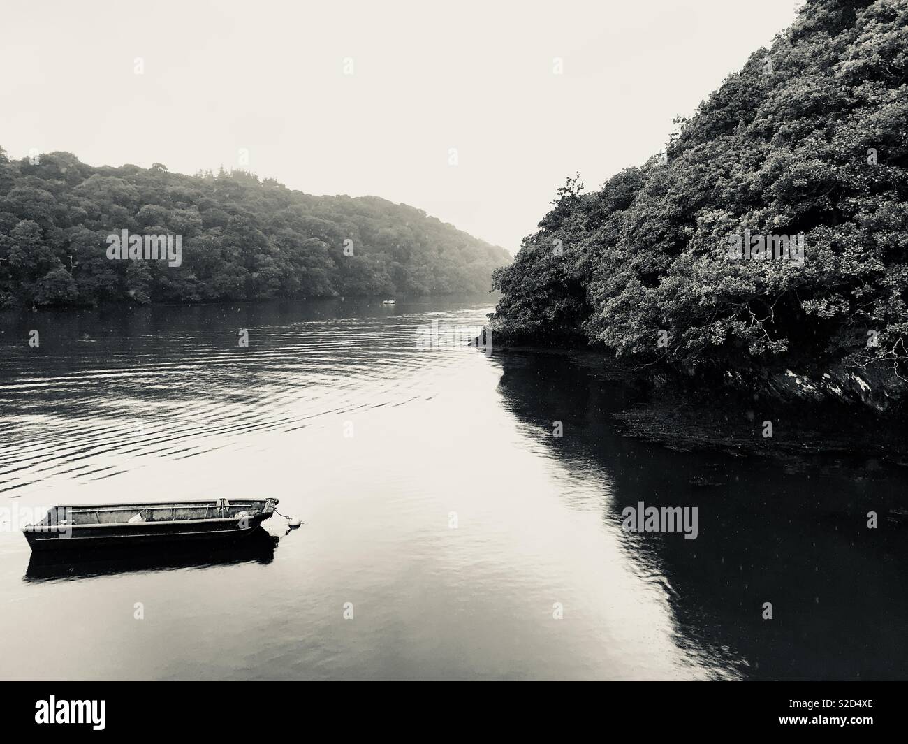 Boat floating on a river Stock Photo - Alamy
