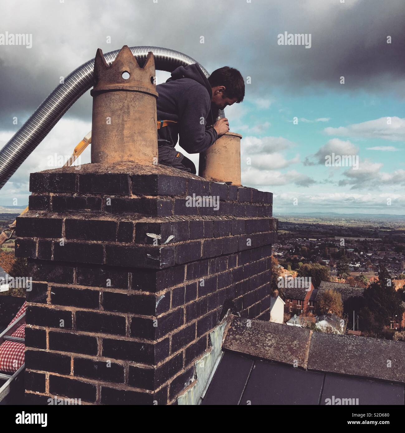 Fitting a chimney liner Stock Photo - Alamy
