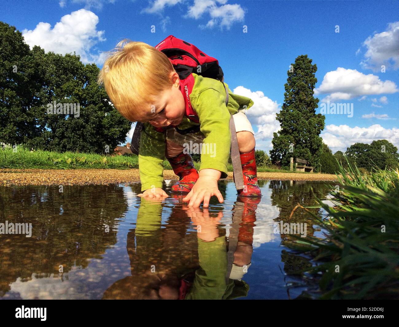 Toddler in puddle Stock Photo - Alamy