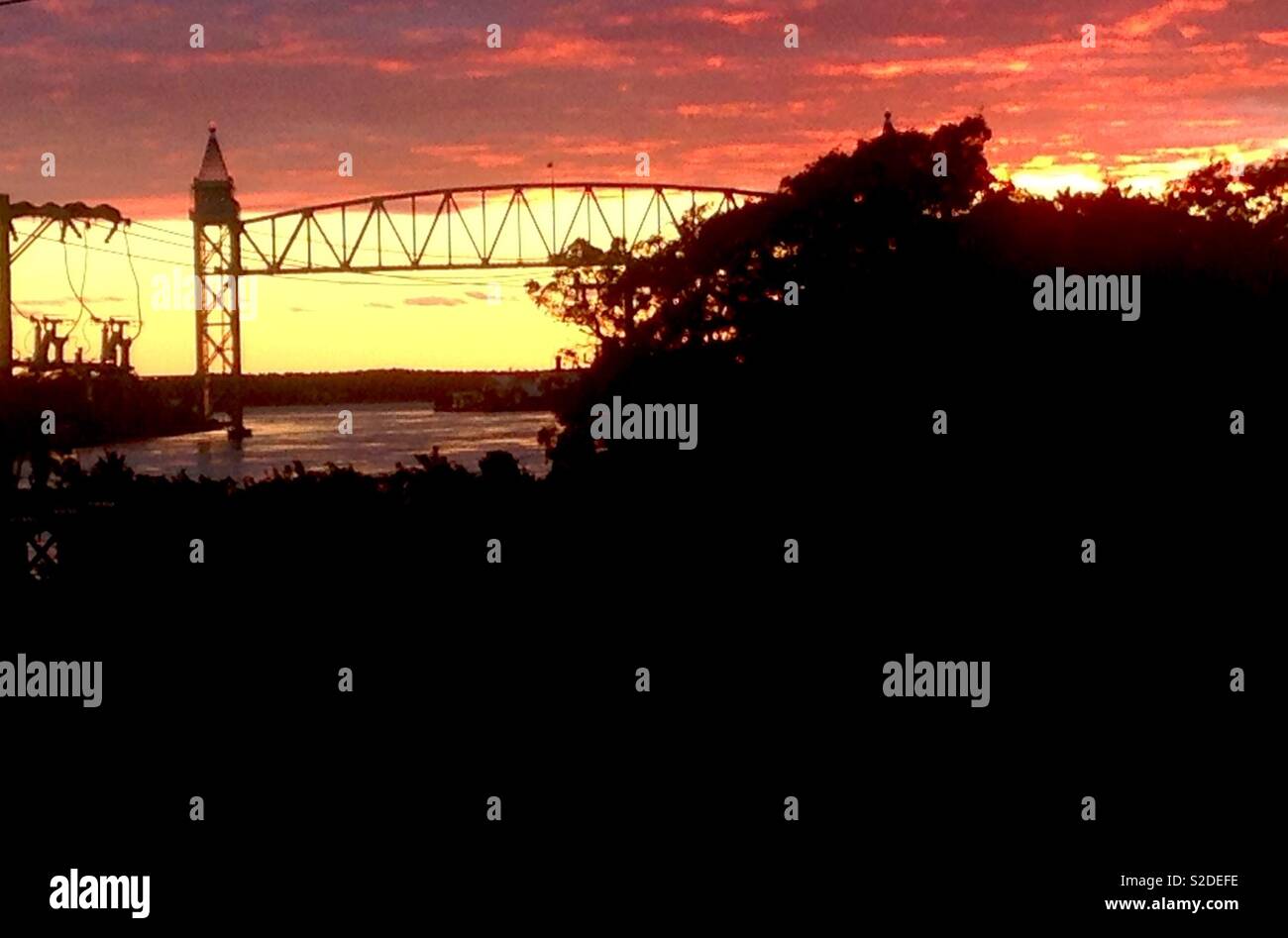 Cape Cod sunset with railroad bridge and canal Stock Photo - Alamy