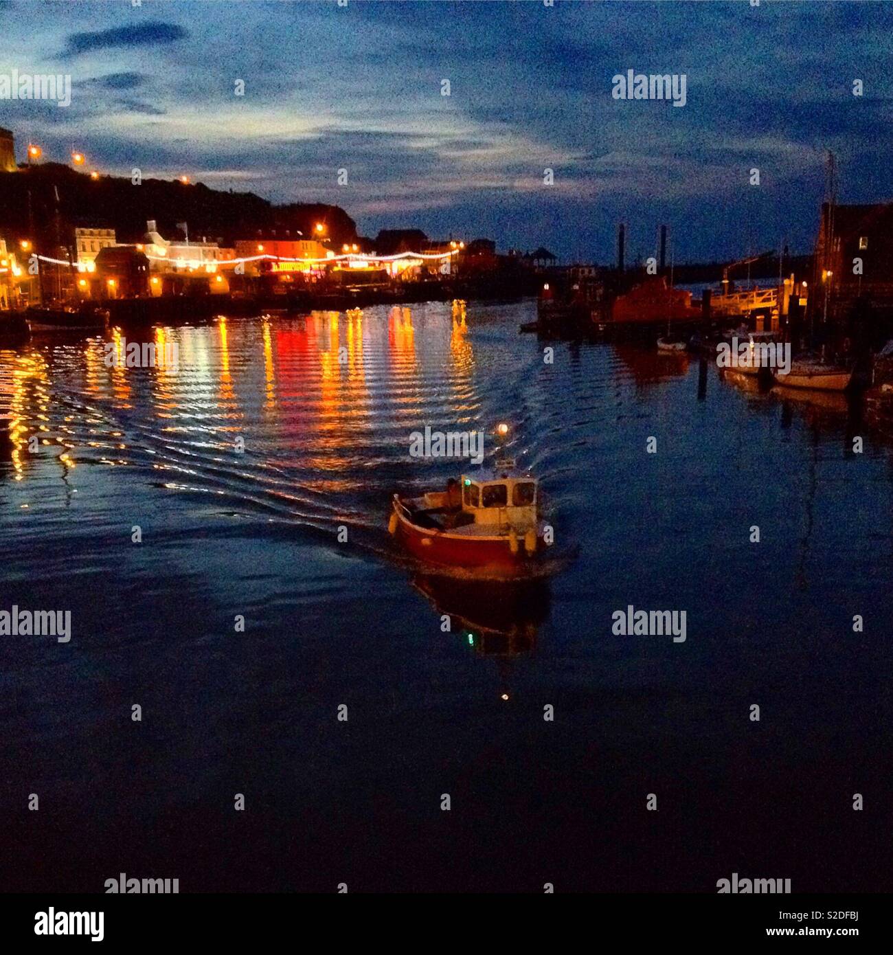 Whitby harbour by night Stock Photo - Alamy