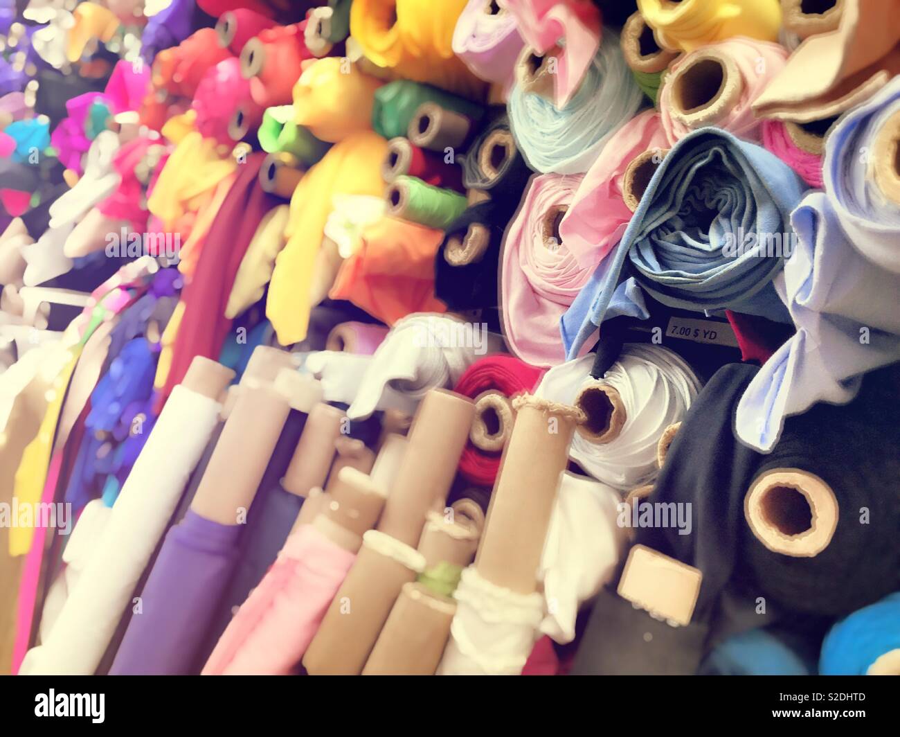 Rolls of fabric in a retail store in New York City’s garment district ...