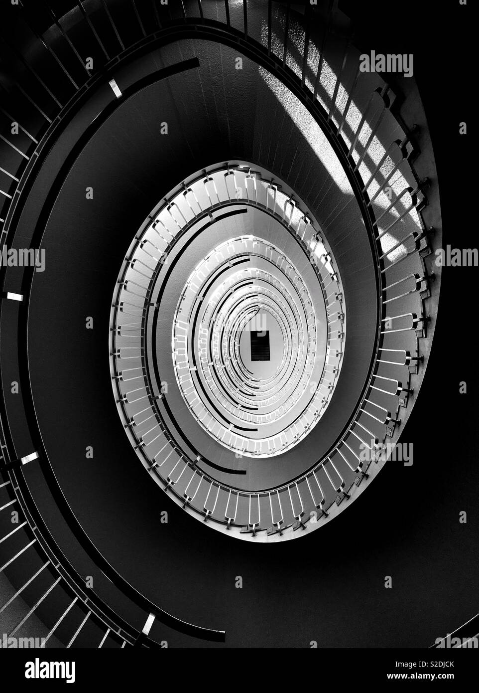 Looking up at spiral staircase Stock Photo - Alamy
