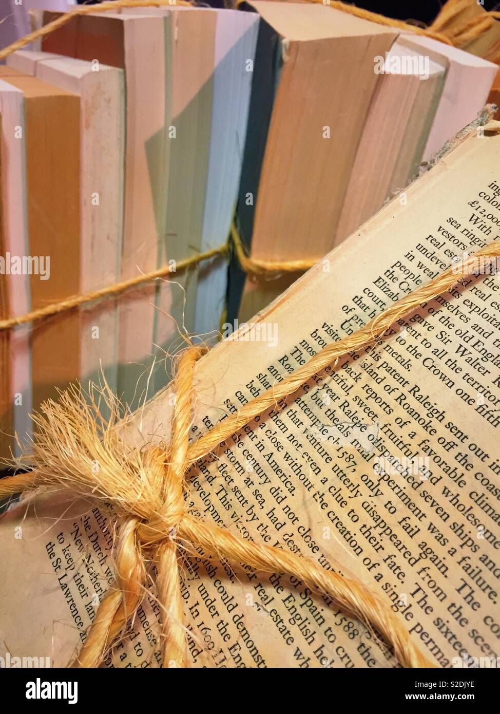 Hardbound books with their covers removed, bound in twine, USA Stock ...