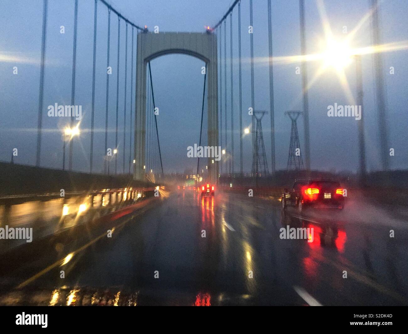 Busy bridge in early morning and heavy rain Stock Photo - Alamy