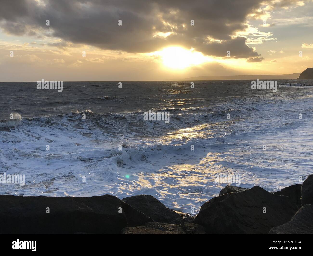 Sunset from the rocks Stock Photo - Alamy