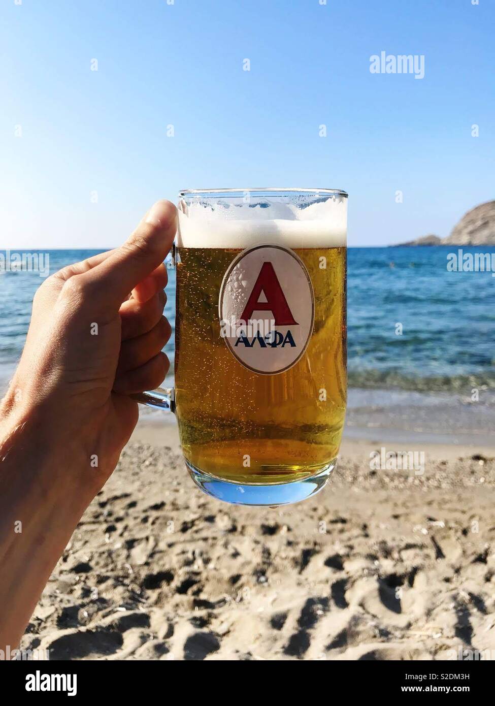 Beer on beach Stock Photo - Alamy