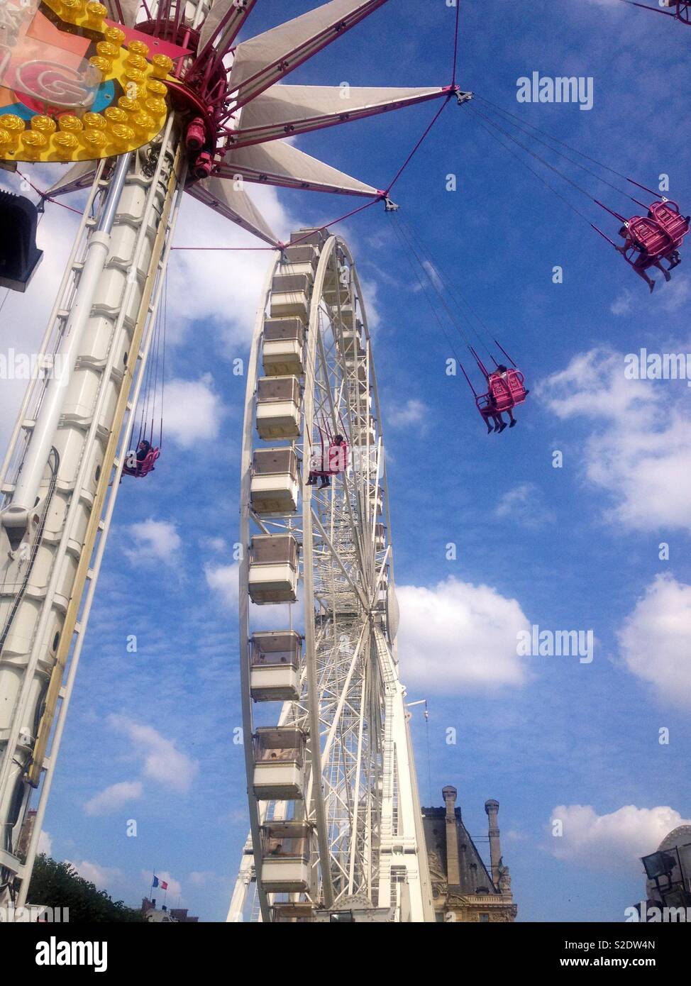 Paris carnival rides hi-res stock photography and images - Alamy