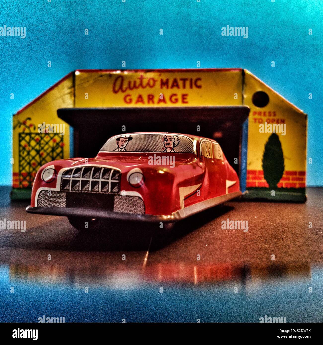Stylised photo of 1950's tin automobile and garage Stock Photo - Alamy