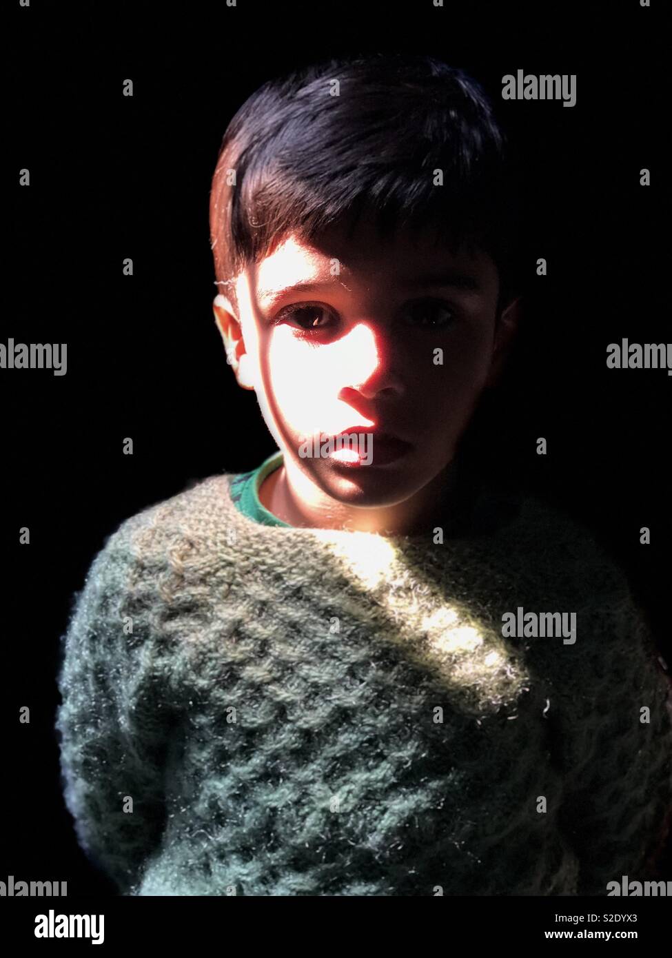 A child standing at sunlight Stock Photo - Alamy
