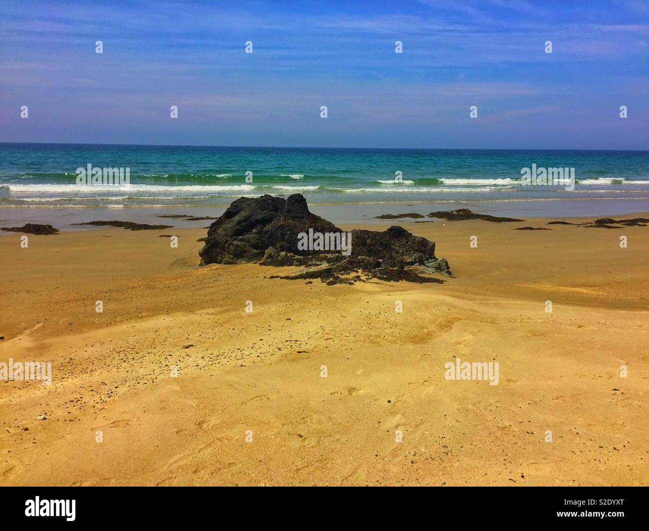 Rocky beach at Penllech near porth colmon Aberdaron North Wales on a ...