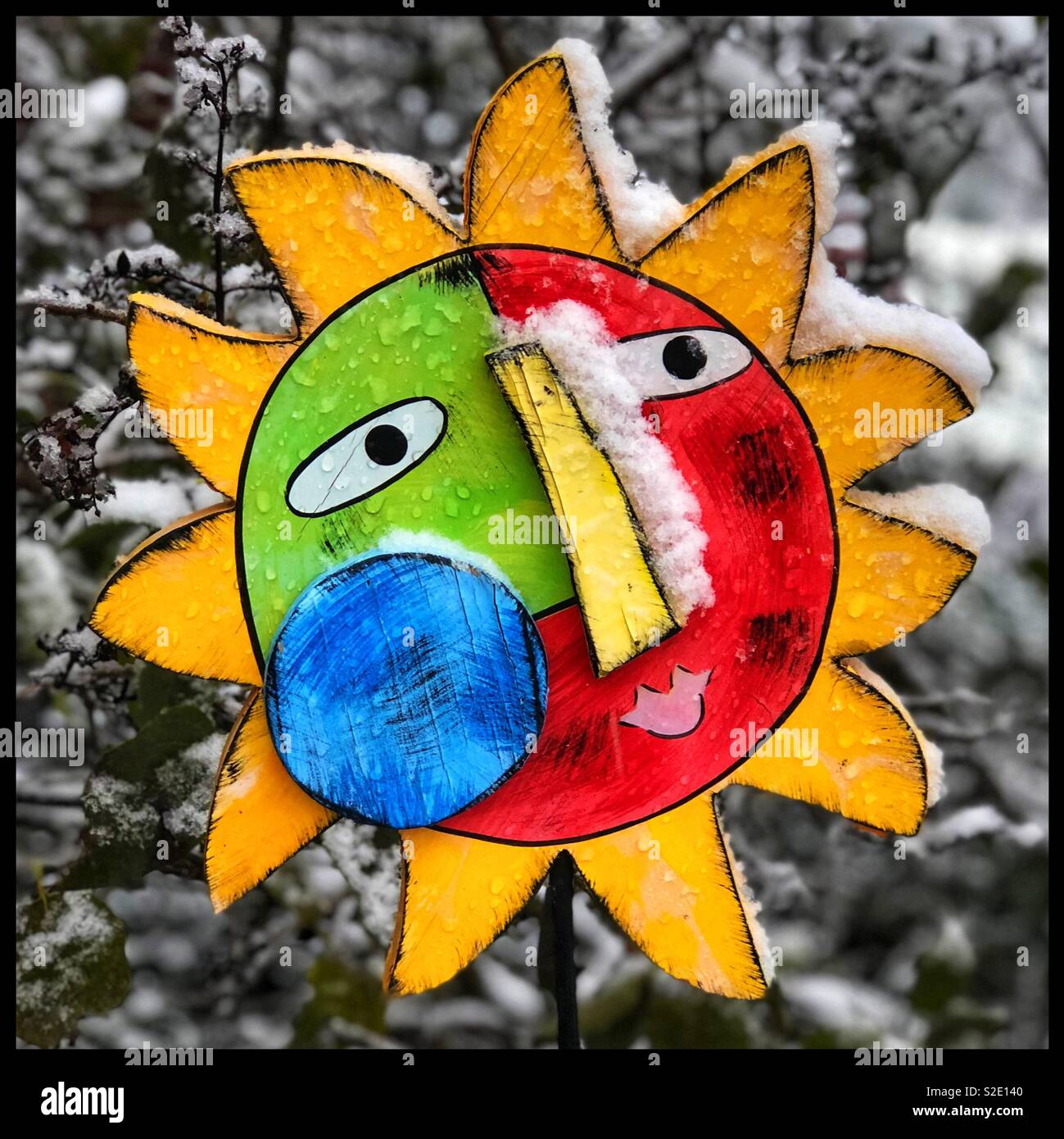 Wooden sun covered with snow Stock Photo - Alamy