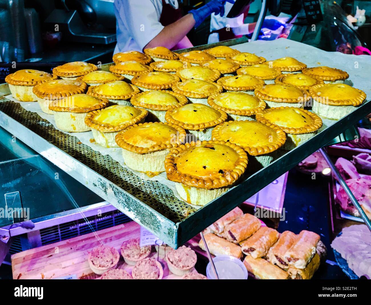 Pork pies in a metal tray in a deli Stock Photo - Alamy