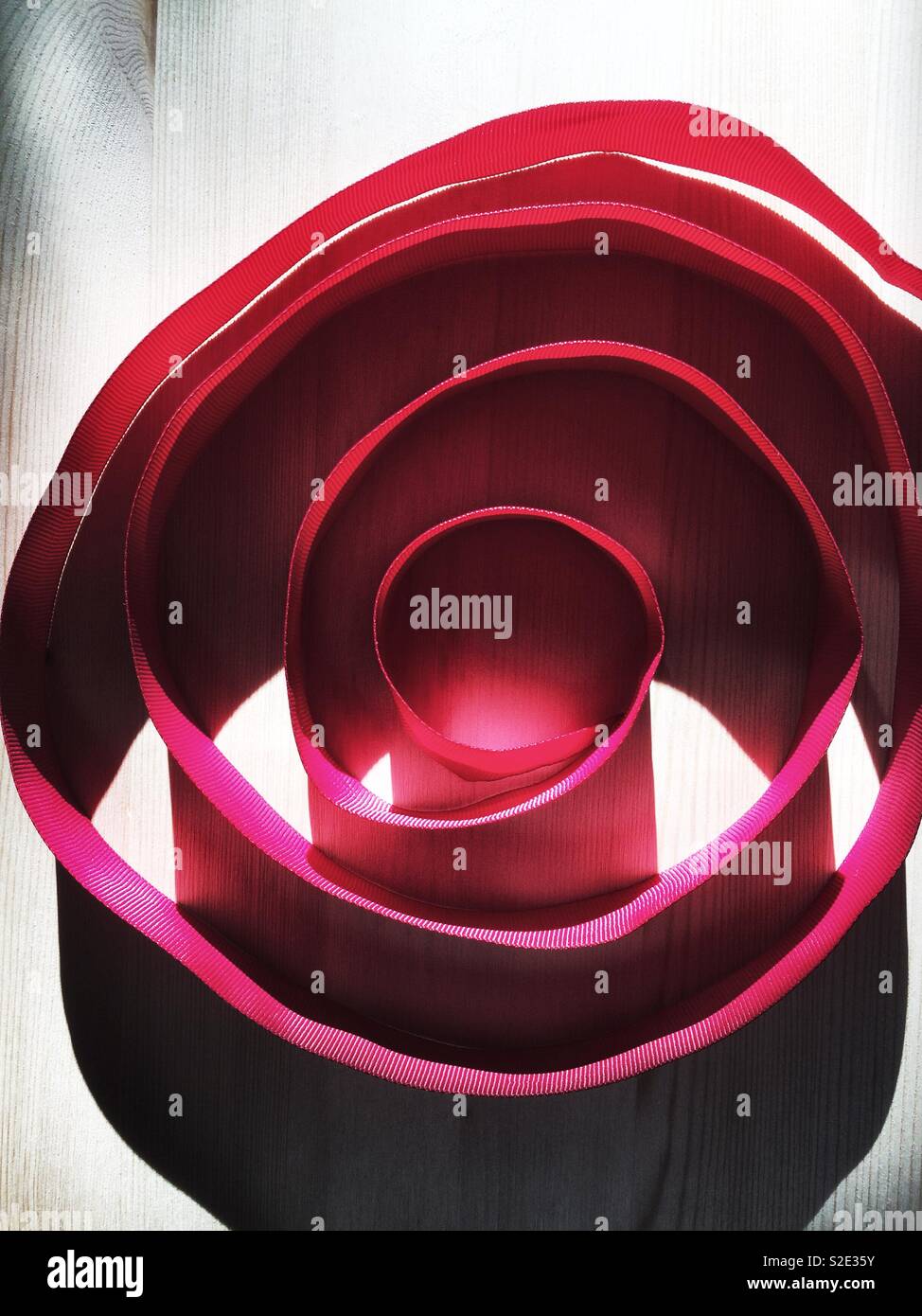 Red ribbon in spiral shape Stock Photo - Alamy