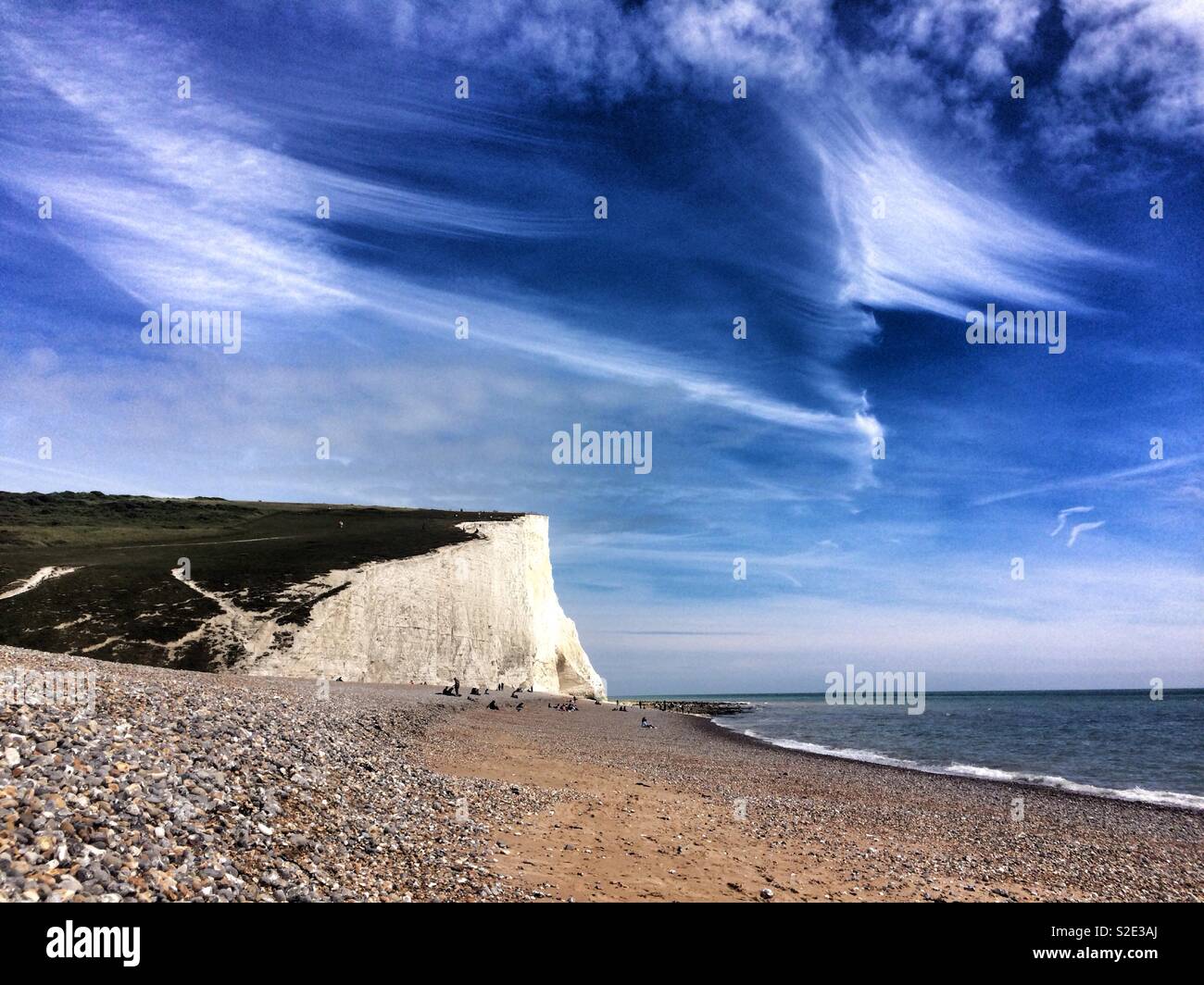 A view up to the famous Seven Sisters white chalk cliffs from the beach ...
