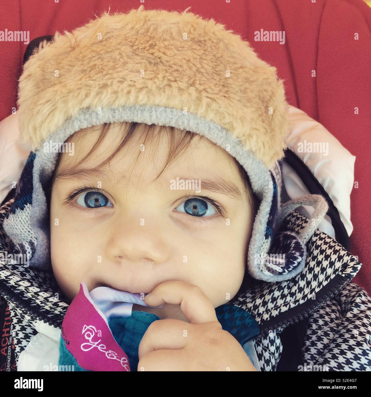 Baby boy wrapped up for winter Stock Photo - Alamy