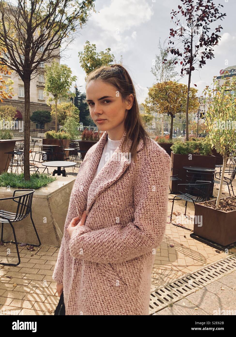 Woman standing in trees hi-res stock photography and images - Alamy