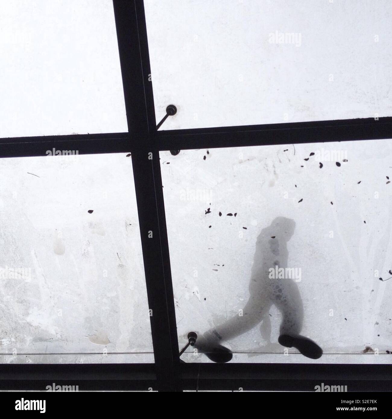 Step on glass roof Stock Photo - Alamy